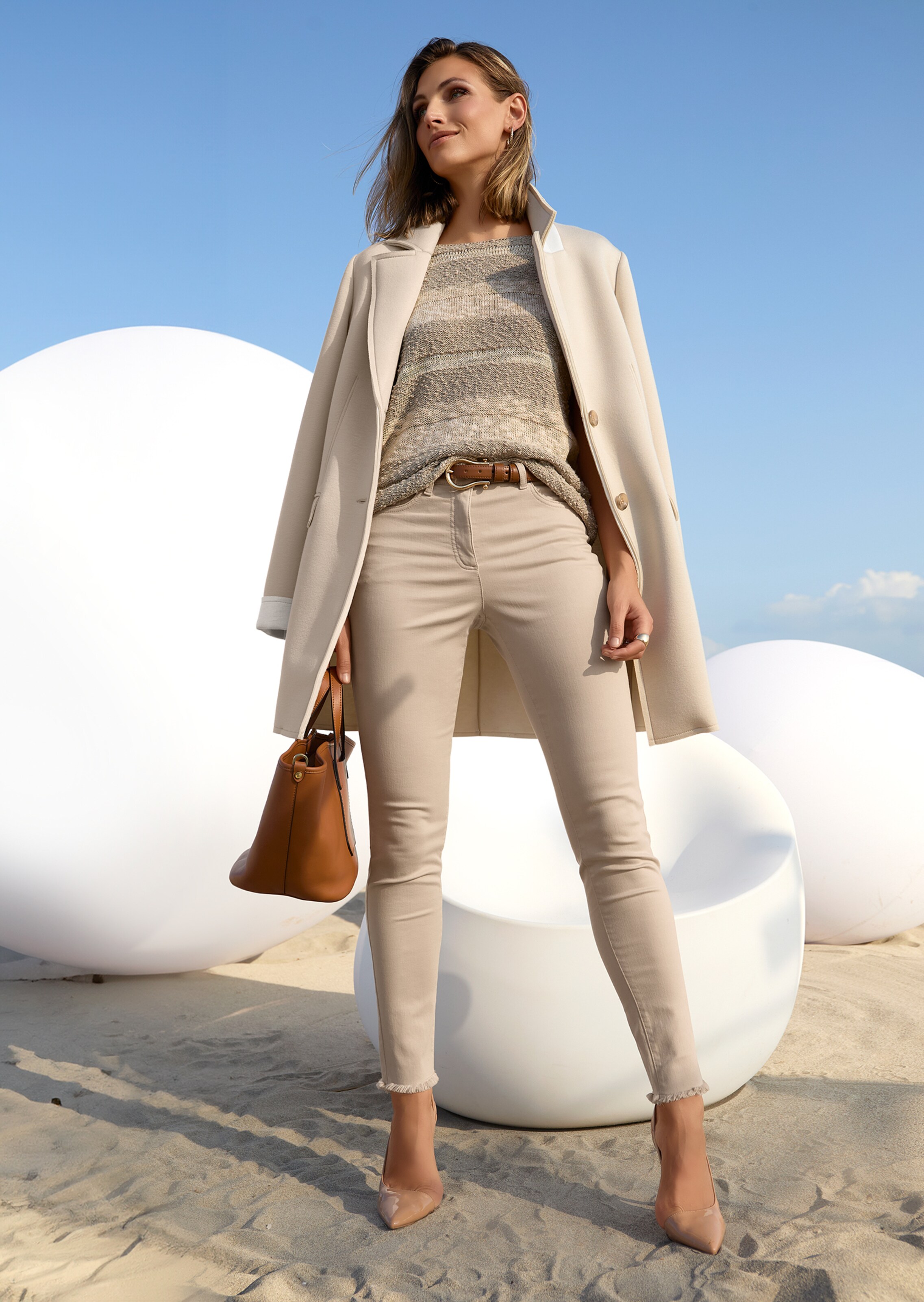 Jeans with fine fringing at the bottom of the legs in berber ...