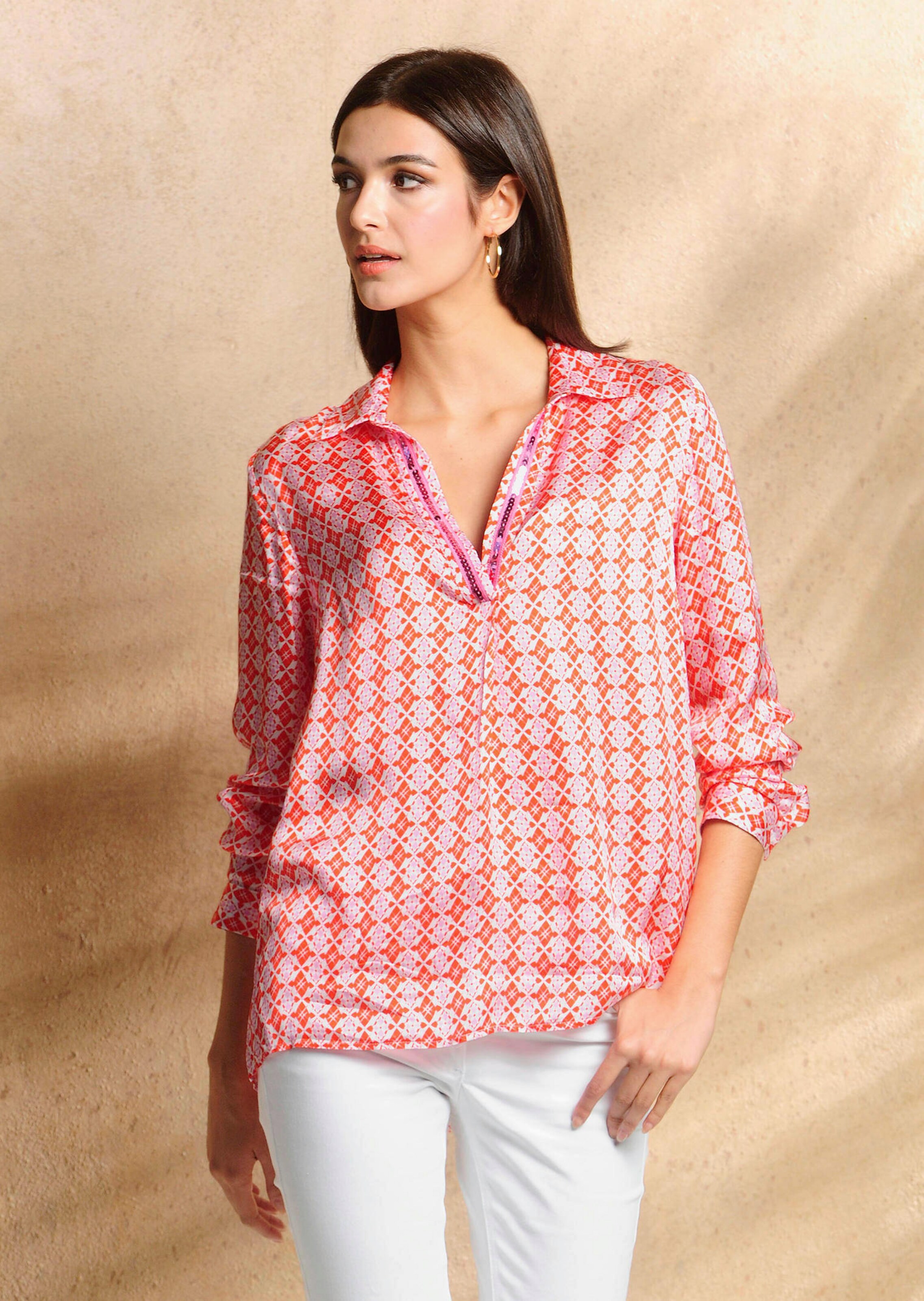 Bluse mit effektvollen Pailletten in orange | MADELEINE Mode