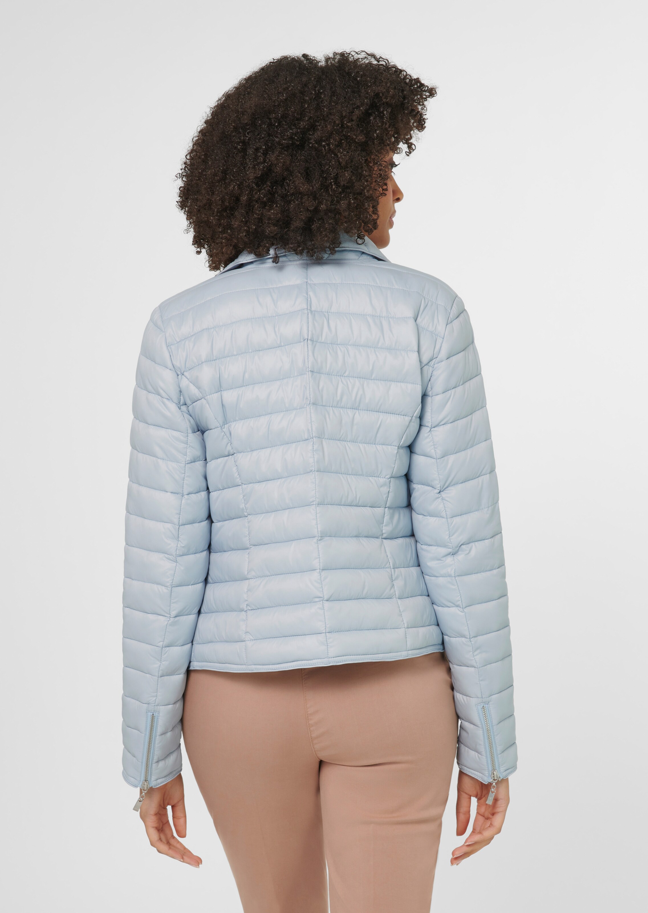 Quilted jacket with light padding in light blue | MADELEINE Fashion