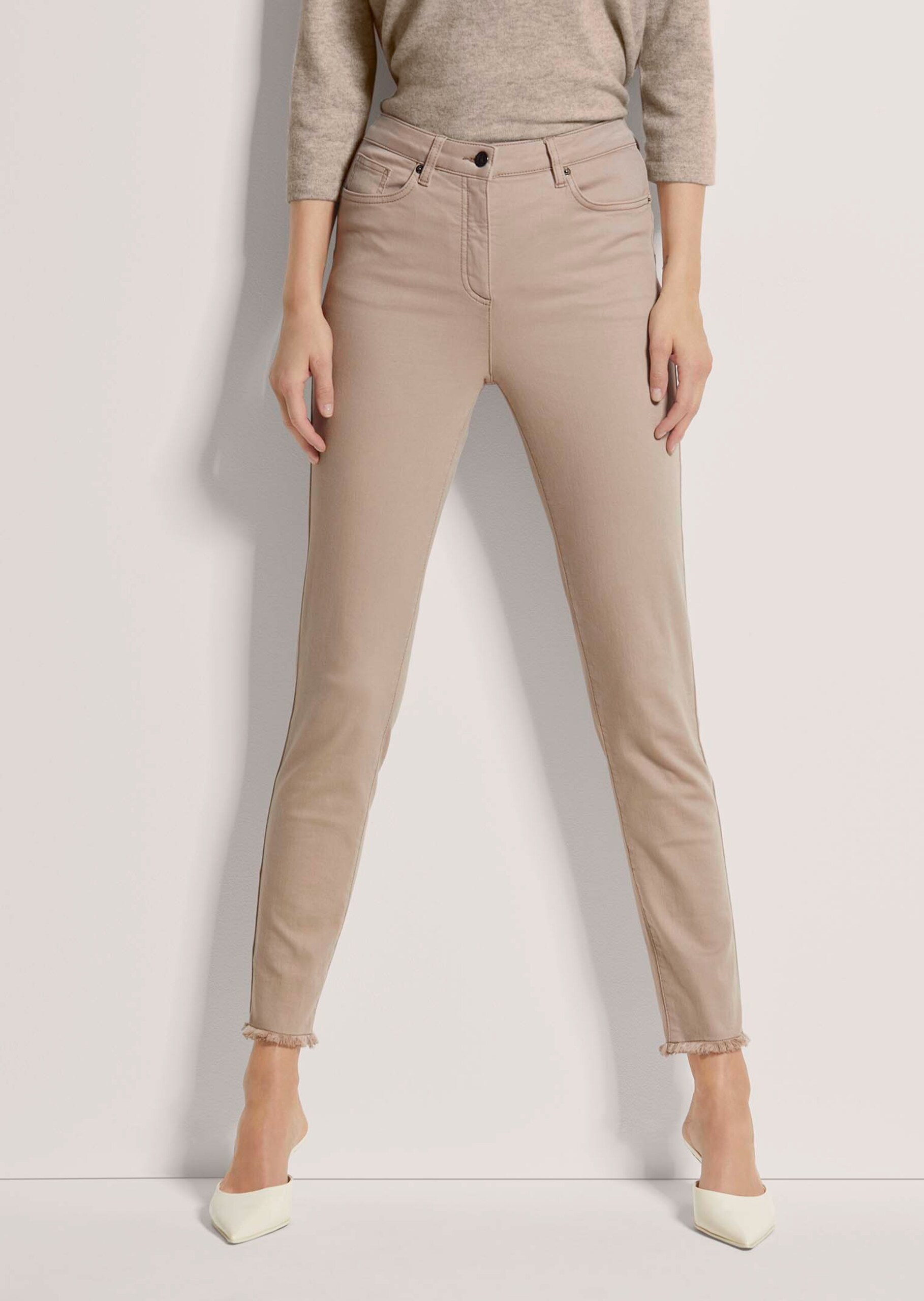 Jeans with fine fringing at the bottom of the legs in taupe | MADELEINE ...